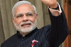 Narendra Modi’s monogrammed suit enters Guinness Book - India News ...