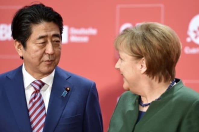 Germany’s Angela Merkel and Japan’s Shinzo Abe urge free trade with ...