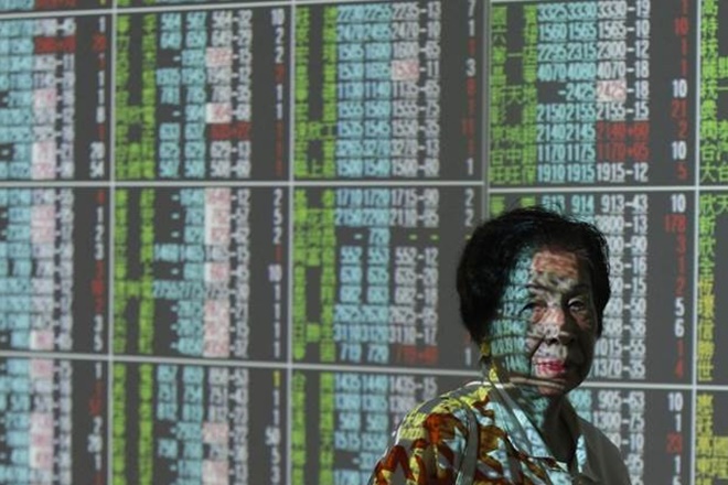 Taiwan stocks move past 10,000 mark, 1st time in 2 years, but pare ...