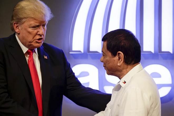 Philippines’ Rodrigo Duterte all smiles as he meets US President Donald ...