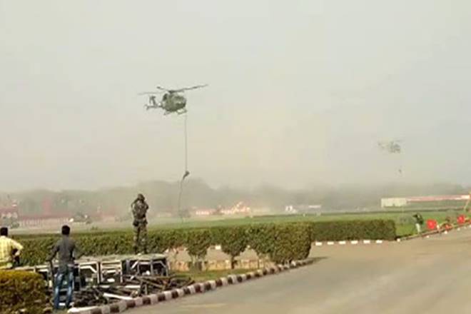 Watch: In freak accident, three soldiers fall off chopper during Army ...