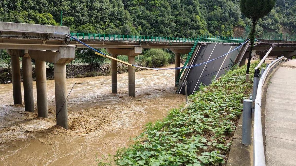 China bridge collapse: 11 people dead, 30 missing as flash floods sweep ...
